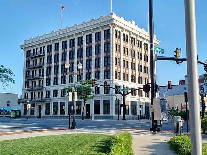This gleaming white building stands like a monument to civic pride, its classical columns commanding respect from every angle.