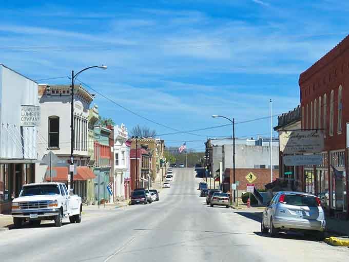 Notice how the American flag adds a patriotic pop against those weathered brick buildings standing proud through generations.