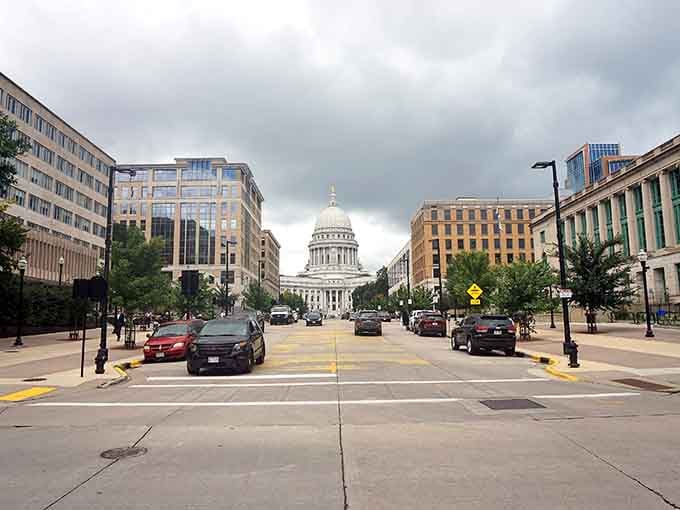 The Capitol dome commands attention like a lighthouse, guiding you straight down Madison's grand boulevard.