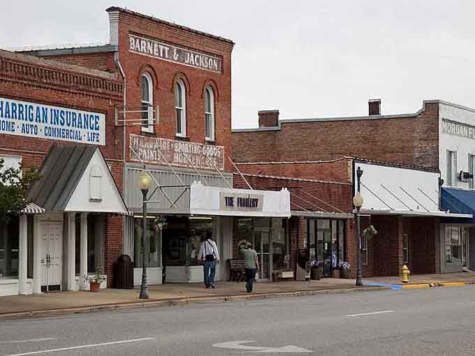 Brick facades and vintage signage create a streetscape where every storefront tells its own unique American story.