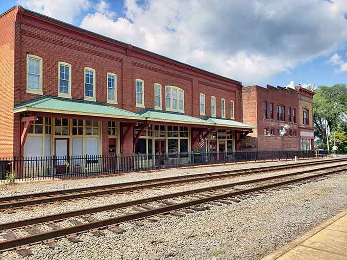 That classic train depot with its green awning whispers stories of travelers past while welcoming those yet to come.