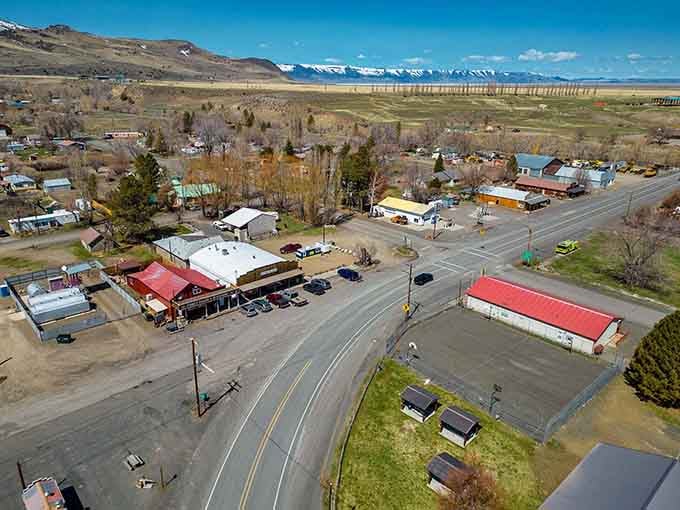 Snow-capped peaks tower over this tiny crossroads where the mountains make even the grain elevators look humble.