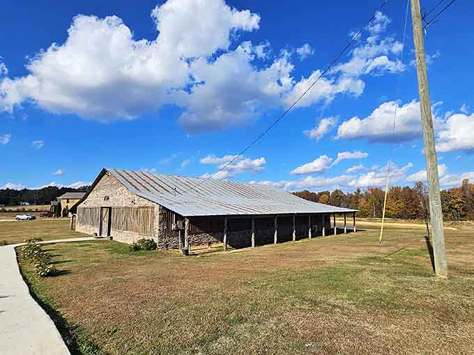 Weathered wood and open fields stretch under cotton-candy clouds in this slice of authentic rural Alabama.