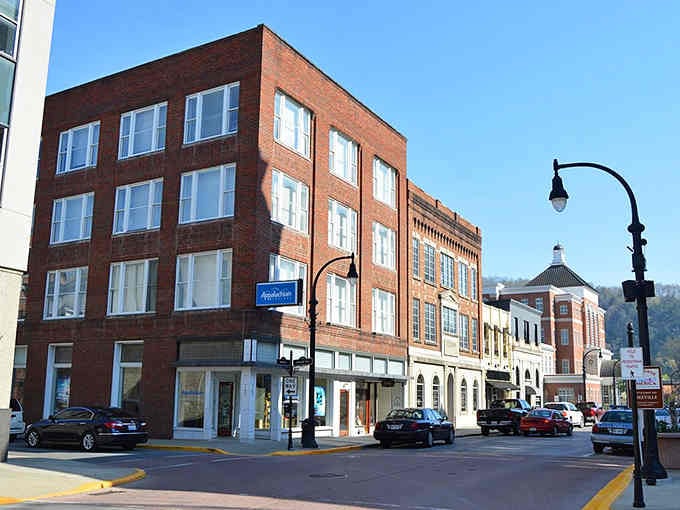 Mountain-backed brick buildings line streets where small-town charm meets Appalachian determination in every carefully preserved storefront.