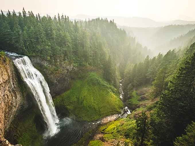 This towering cascade plunges nearly 300 feet through misty forest air, creating its own weather system of rainbows and spray.