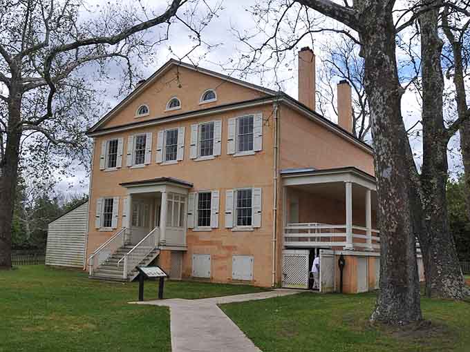 This historic mansion stands quietly among bare trees, holding centuries of Pine Barrens stories within its walls.