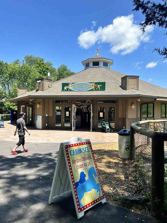 The carousel building beckons with old-fashioned charm, promising rides that never go out of style, unlike your dance moves.