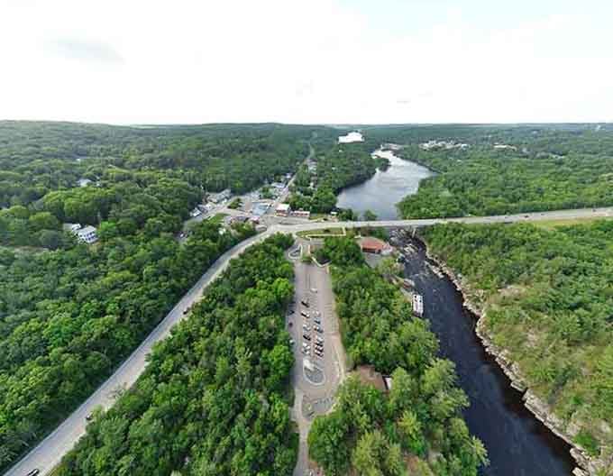 From this bird's eye view, the river carves through endless green forest like nature's own highway through the wilderness.