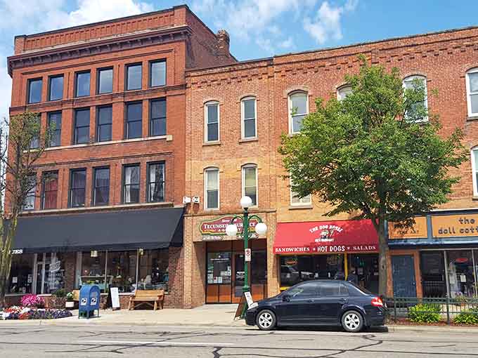Flower boxes and brick buildings create a scene so perfectly Main Street USA, Norman Rockwell would've set up his easel.