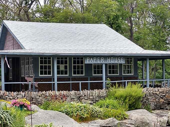 The Paper House sits peacefully behind its rock garden, a testament to one person's wildly creative vision.