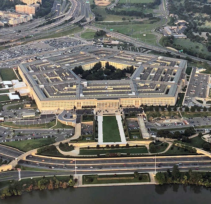 From above, the world's largest office building reveals its perfect five-sided geometry, an architectural marvel housing thousands of dedicated workers.