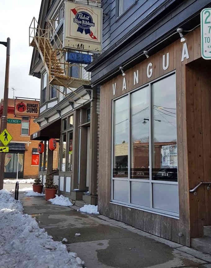 The Pabst sign and modern wood facade blend Milwaukee tradition with contemporary cool on this vibrant corner.