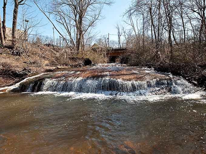 Early spring reveals Tinton Falls in its raw, honest beauty&mdash;water cascading over weathered rocks like nature's own fountain.