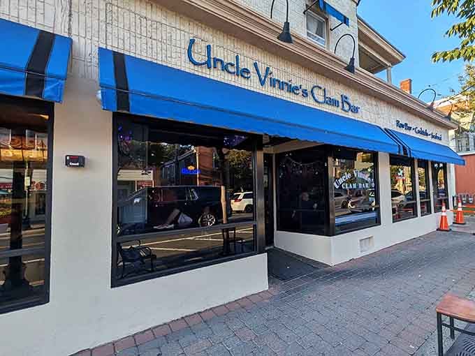 Uncle Vinnie's bright blue awning stands out like a sapphire in a sea of ordinary storefronts.