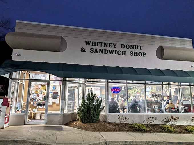 The glowing neon "OPEN" sign at dusk beckons like a lighthouse for hungry souls seeking comfort food.