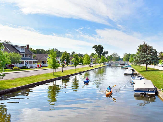 Kayakers glide through residential canals like they're living in a Midwestern Venice, minus the gondolas and Italian accents.