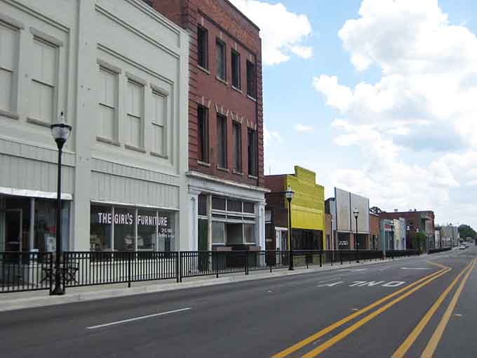Wide-open Main Street with colorful buildings lined up like a rainbow of affordable living options waiting for you.