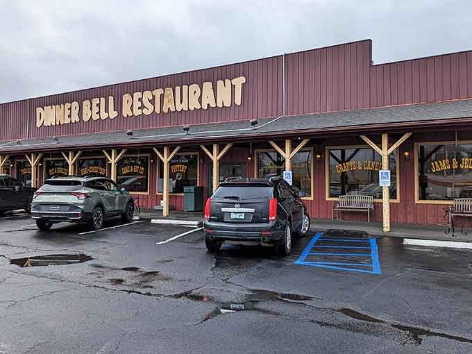 Those rustic wooden beams frame the entrance like a barn raising, but for hungry folks instead.