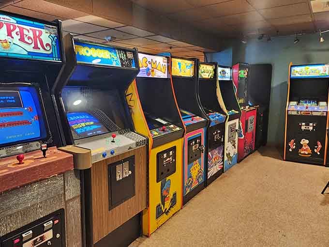 Rows of glowing arcade cabinets stand ready like colorful soldiers, waiting to transport you back to simpler times.