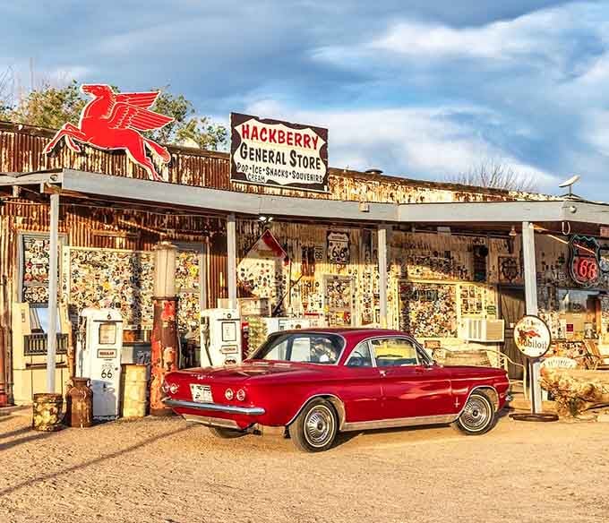 Golden hour transforms this roadside treasure into a photographer's dream, where every rusted pump tells tales of cross-country adventures past.