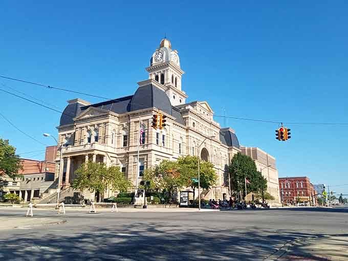 The ornate clock tower rises majestically, proving that government buildings once doubled as architectural masterpieces worth photographing.