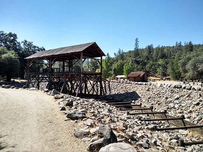 Wooden mining structures stand preserved along the river, echoing with stories of fortune seekers and Gold Rush dreams.