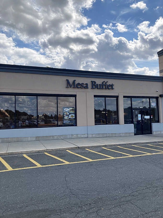 Dramatic clouds frame this modern buffet spot where global cuisines meet under one welcoming roof in Springfield's heart.