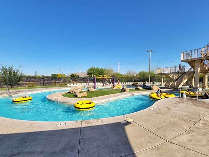 Bright yellow tubes circle the lazy river like a cheerful parade waiting to carry you away.