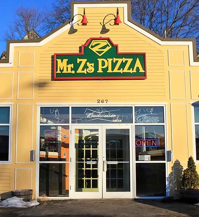 The cheerful yellow facade practically glows with the promise of perfectly melted cheese and crispy crusts within.