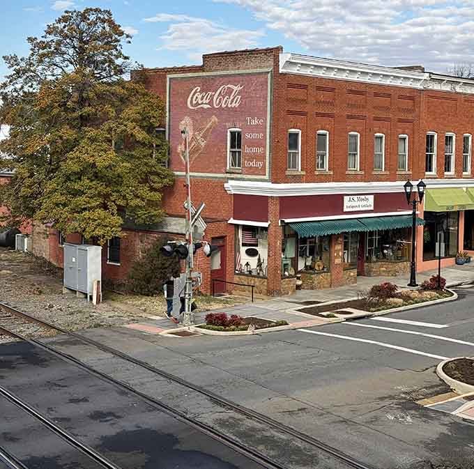 That vintage Coca-Cola sign has watched generations pass by, still reminding folks to pause and refresh themselves.