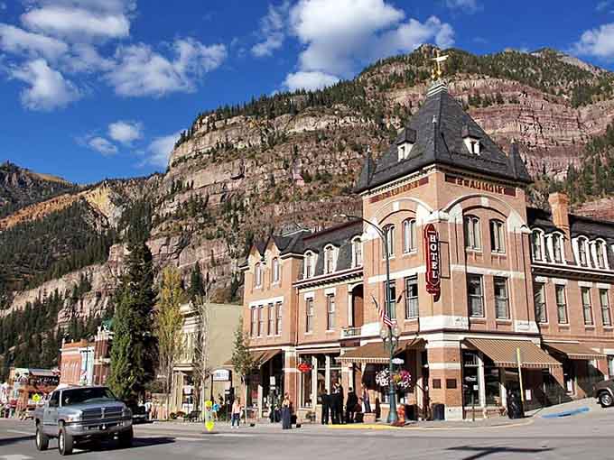 Layered mountains create a natural amphitheater around Victorian architecture that's been camera-ready for over a century.