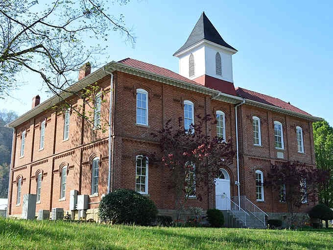 This stately brick courthouse stands as a testament to community pride, its white cupola reaching skyward like a beacon.