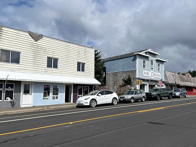 Weathered buildings line the street in classic coastal style, where every storefront tells stories of fishermen and families who call this home.