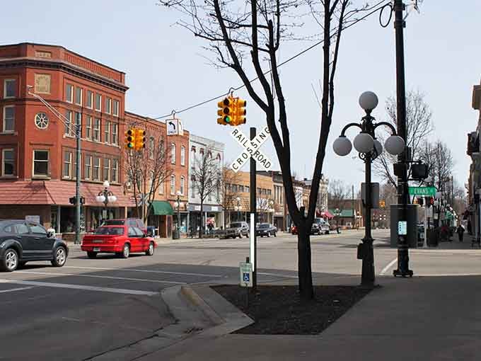 Classic street lamps and bare winter trees frame this quiet downtown moment when the town takes a peaceful breath.