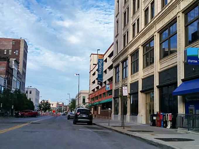 Toledo city streets welcome you with charming architecture and a clear blue sky, perfect for a peaceful afternoon urban stroll.