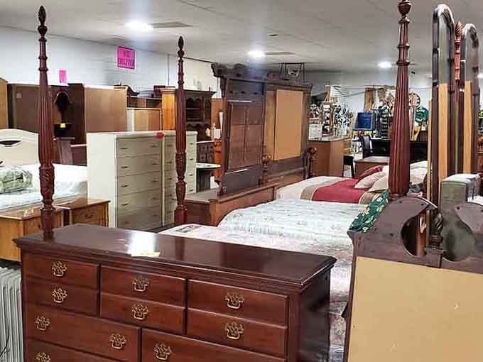 Four-poster beds stand ready to host dreams, proving furniture shopping doesn't require a showroom or a second mortgage.