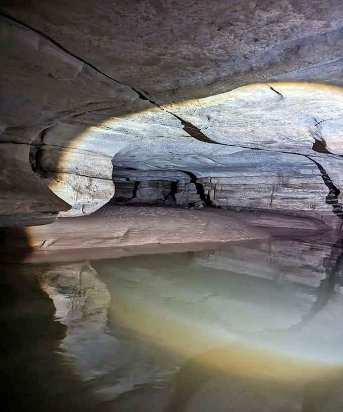 Still waters mirror the sculpted ceiling above, doubling the beauty in this quiet chamber where echoes are your only companion.