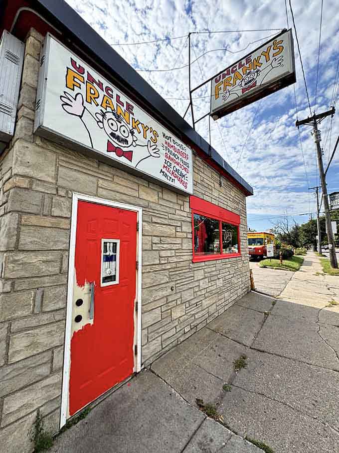 The bright red door welcomes you into a world where hot dogs are taken seriously and smiles come standard.