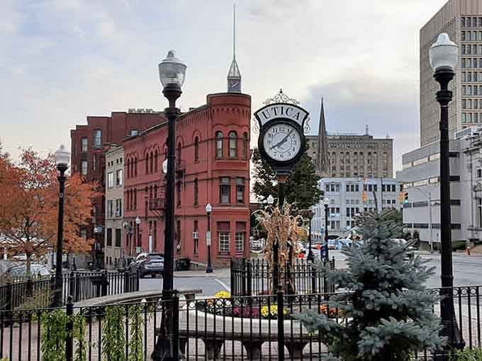 That iconic clock tower keeps time over brick buildings and autumn trees, creating a scene straight from a Hallmark movie set.