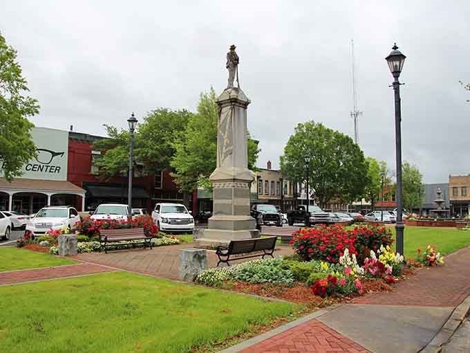 Flowers blooming around a monument in the square—this is community pride you can see from across the street.