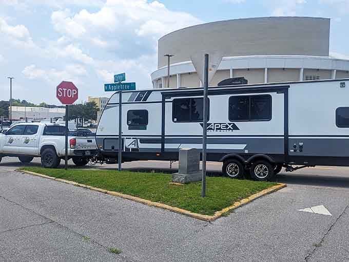 An RV parks beside the world's most compact city block, where Foster meets Troy in miniature glory.
