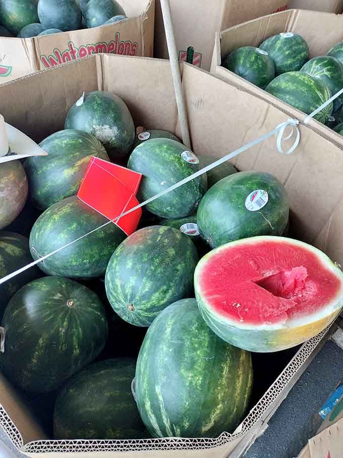 Watermelons piled high with that telltale red flesh promising summer sweetness in every juicy bite you take.