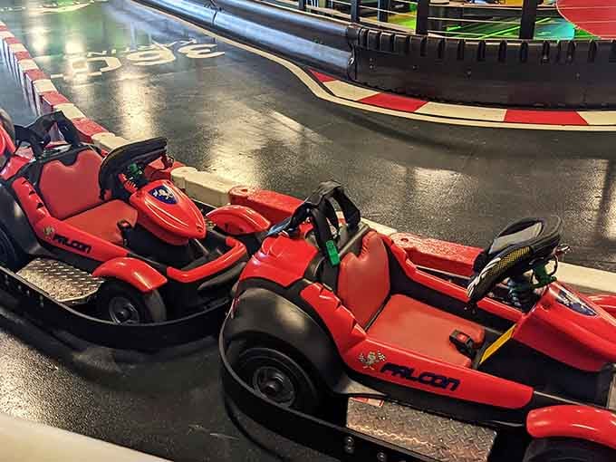 Red karts lined up like thoroughbreds at the starting gate, ready to unleash some serious speed on demand.