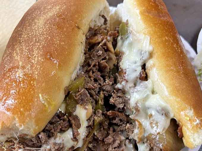 The cheesesteak oozes melted goodness like a delicious dairy volcano you'll want to dive into headfirst.