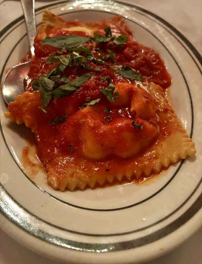 Homemade ravioli pillows stuffed with ricotta and covered in sauce that's been perfected over countless Sunday dinners.