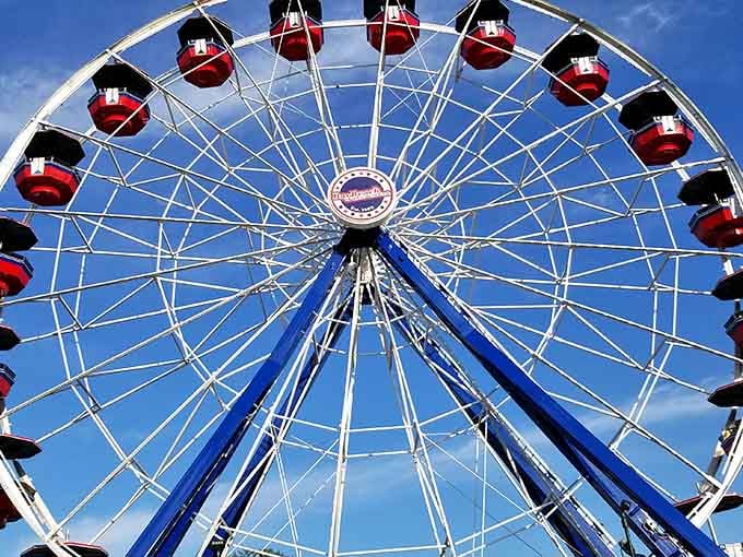 Looking up at this classic Ferris wheel feels like gazing at a perfectly symmetrical piece of nostalgic art.