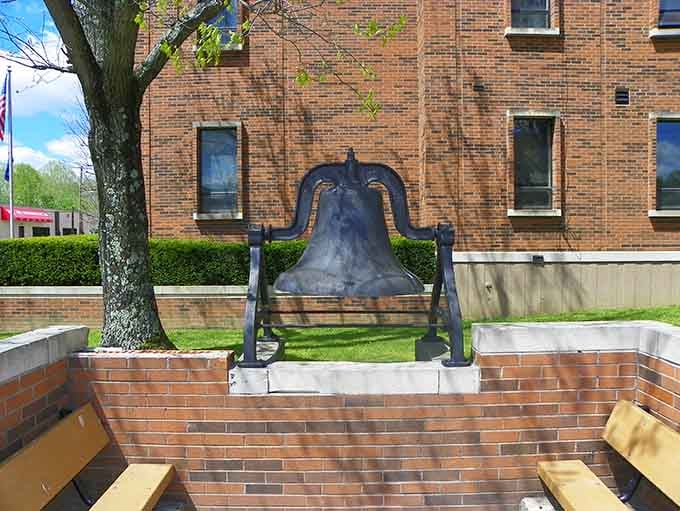 This historic bell has witnessed more town history than any gossip circle, standing silent and dignified through decades.