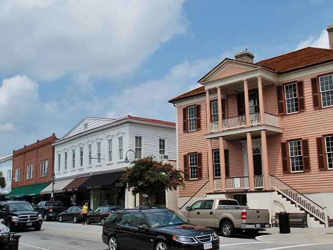 That peachy-pink mansion rising above the streetscape makes you wonder if Scarlett O'Hara might stroll out any minute.