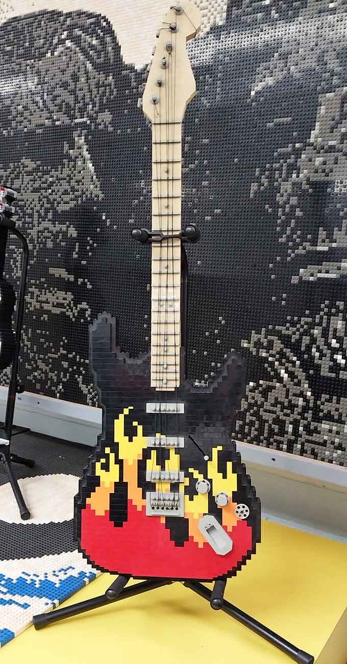 A full-sized electric guitar built entirely from plastic bricks that looks ready to rock your world.