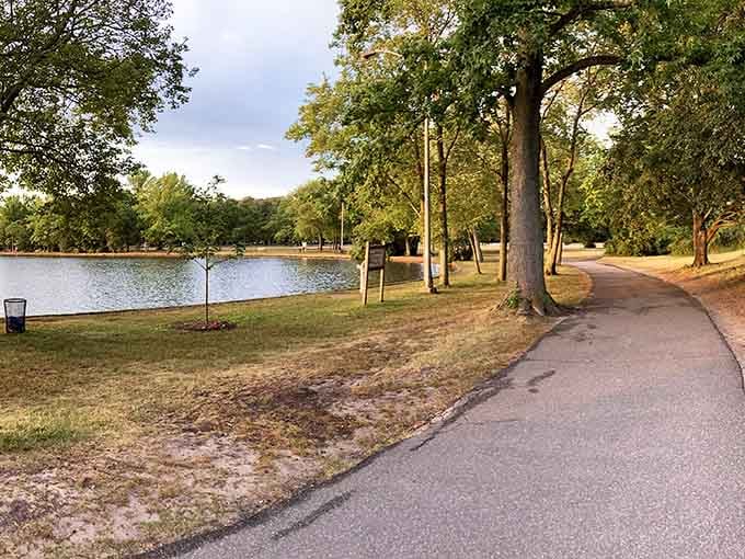 A peaceful lakeside path where the only traffic jam involves ducks crossing at their own leisurely pace.
